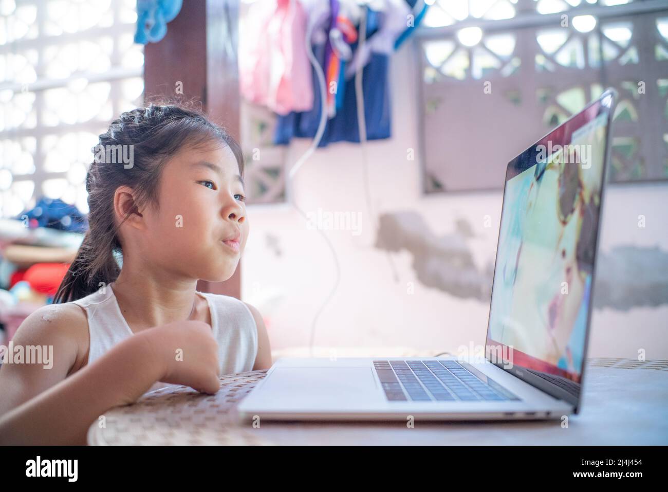 School girl online learnning class with laptop computer in home Stock ...