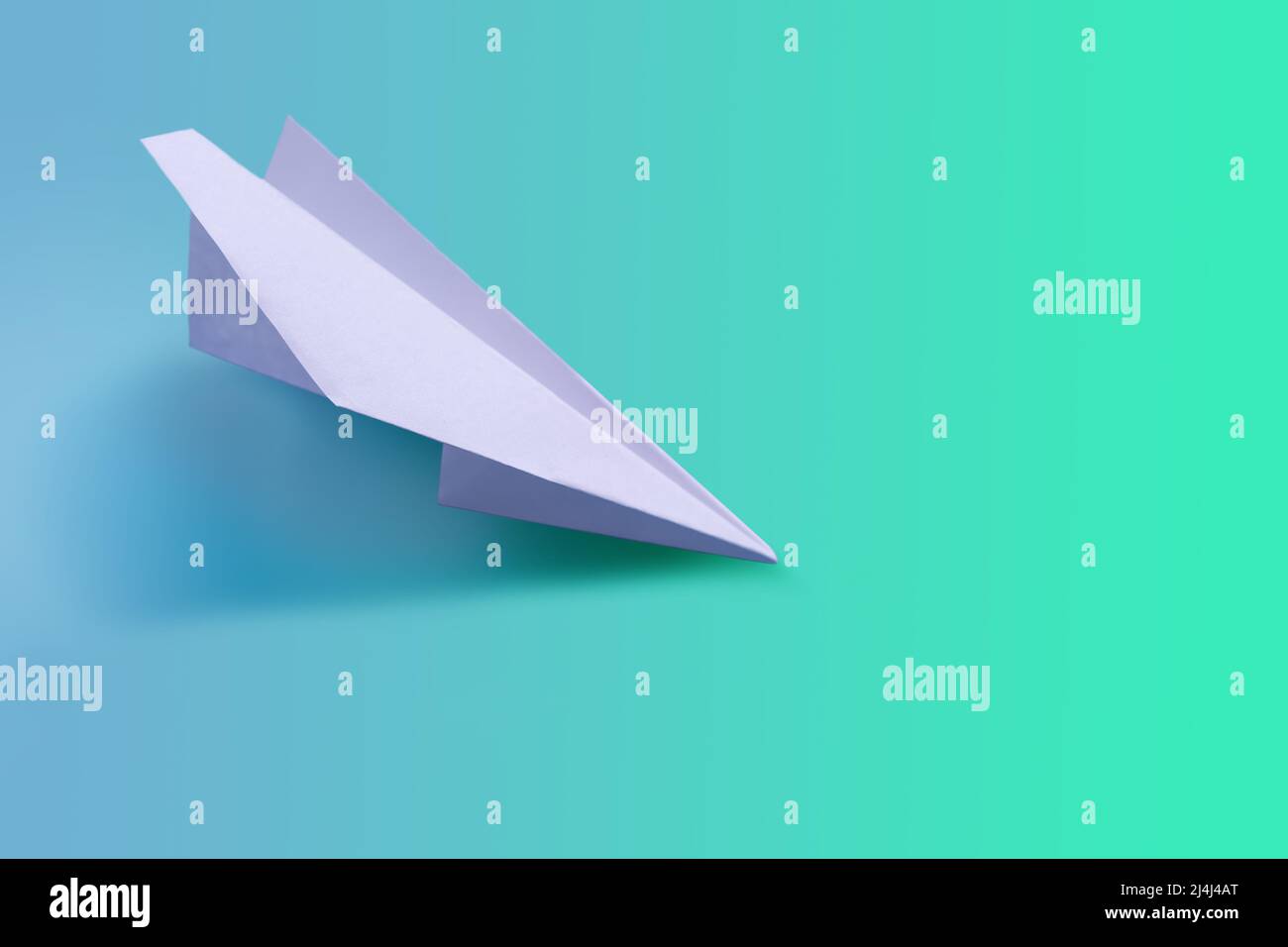 Paper airplane on a tone-harmonious background, toned Stock Photo - Alamy