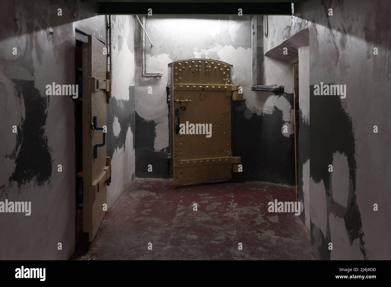 Abstract dark grungy industrial interior with massive steel doors ...