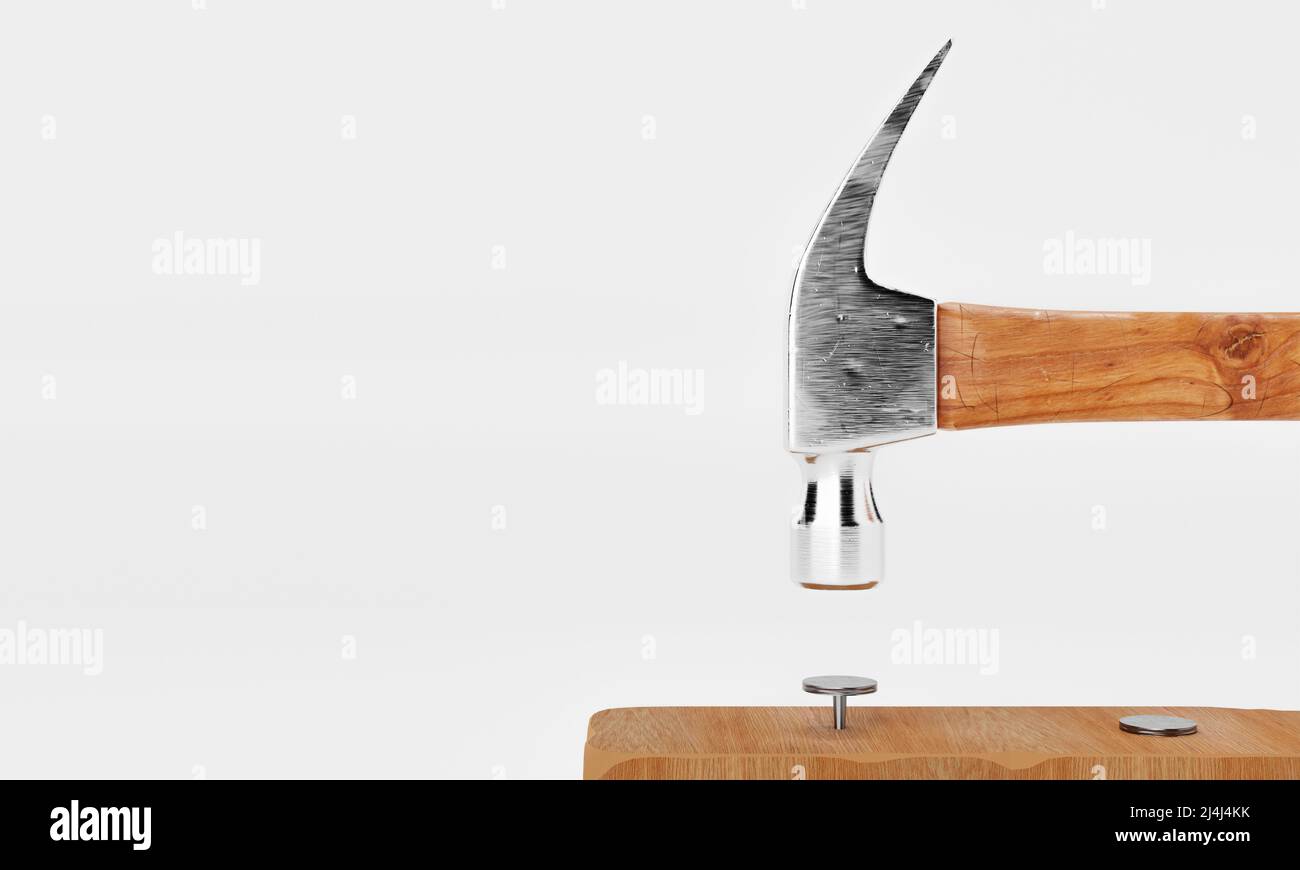 Hammer and nail head at wooden plank on isolated white background with ...