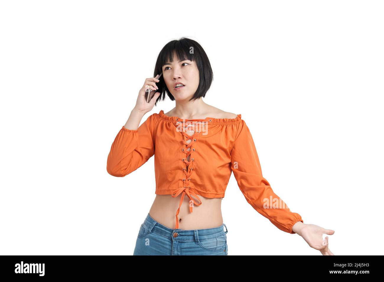 Young asian woman talking angrily on the smartphone, isolated Stock ...
