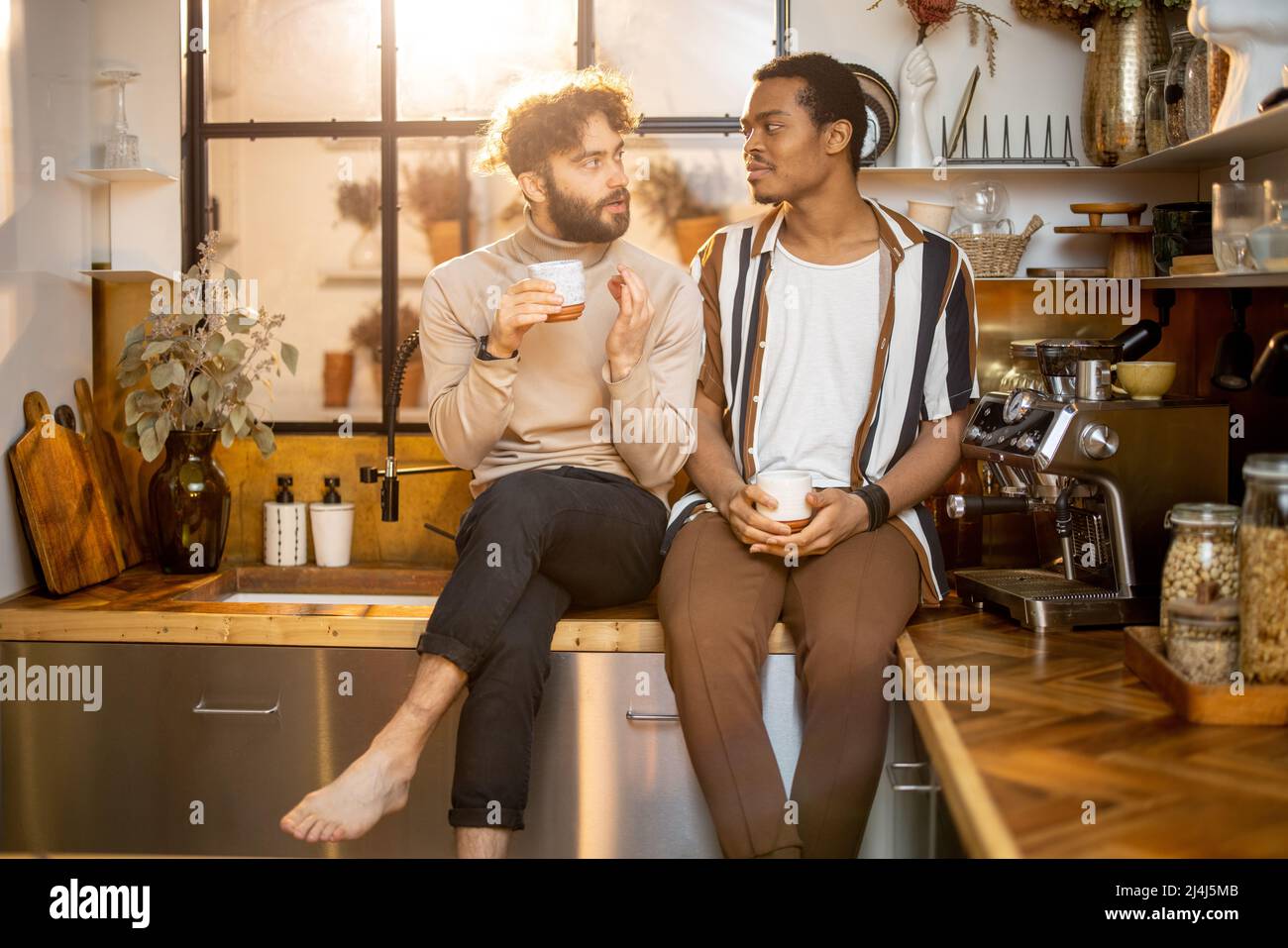 Latino couple talking kitchen hi-res stock photography and images - Alamy