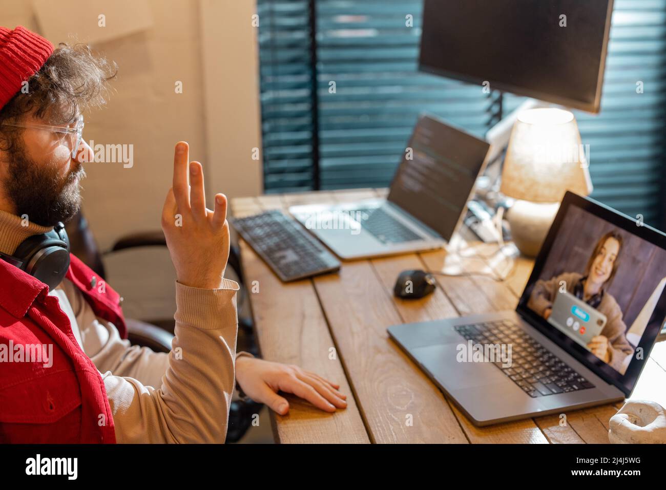Female having video call waving hi-res stock photography and images - Alamy