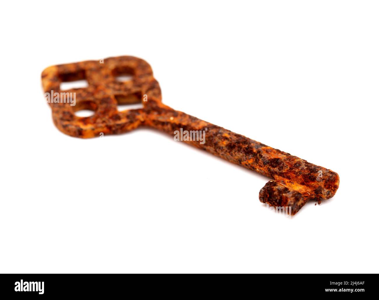 Old very rusty key isolated on white background Stock Photo - Alamy