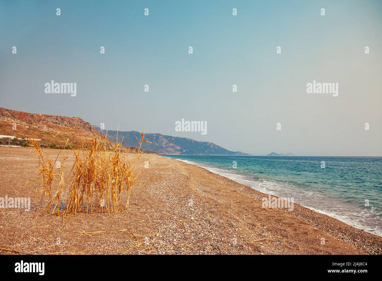 Turkey sea beach landscape with dry grass on foreground Stock Photo - Alamy