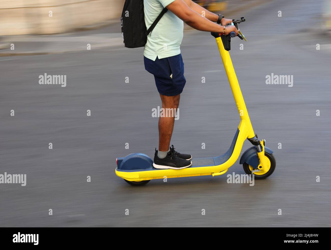 person running fast on the electric scooter to visit the city at speed ...