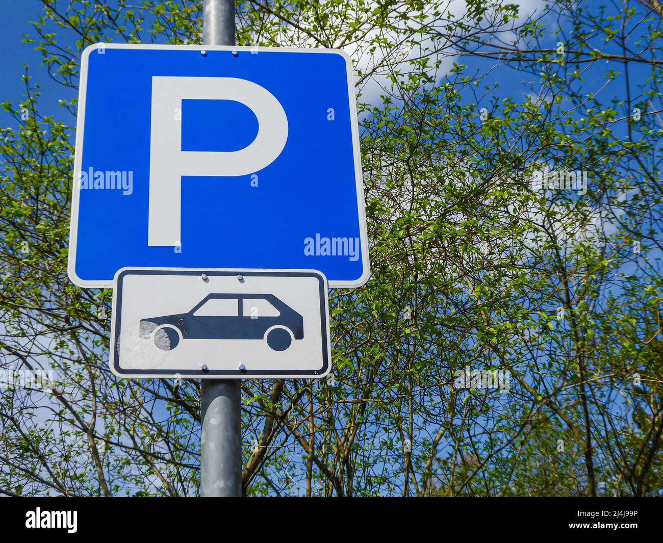 blue parking sign with the addition car in Germany indicates that only ...