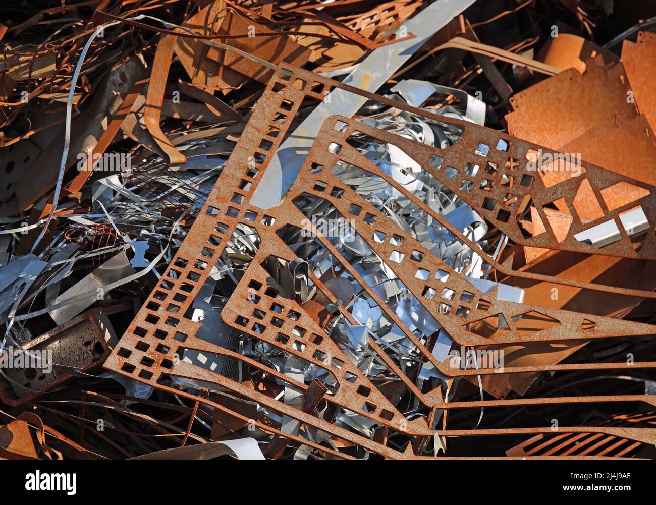 background of rusty scrap in a recycling shop where ferrous material ...