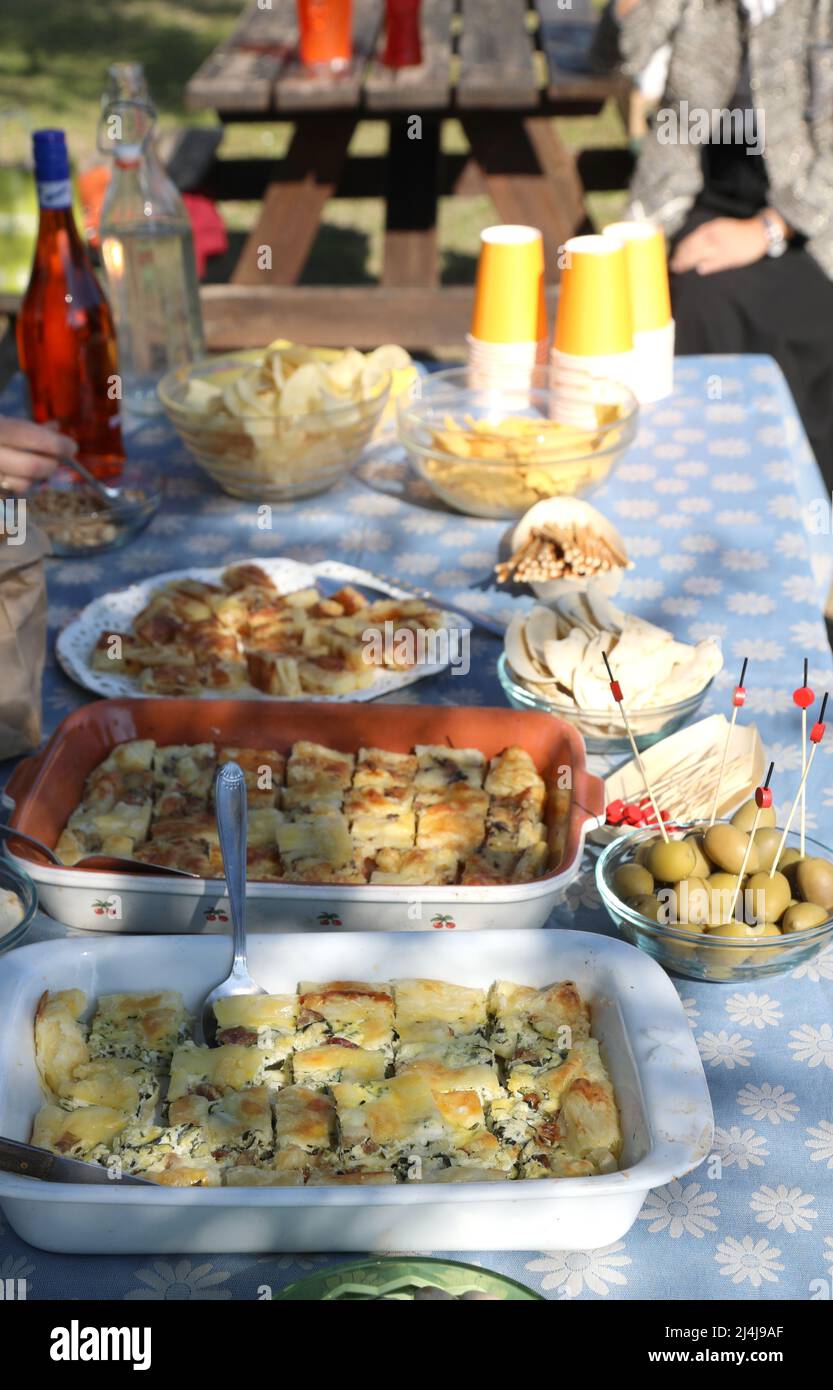 table set for a birthday party with many delicacies appetizers and ...
