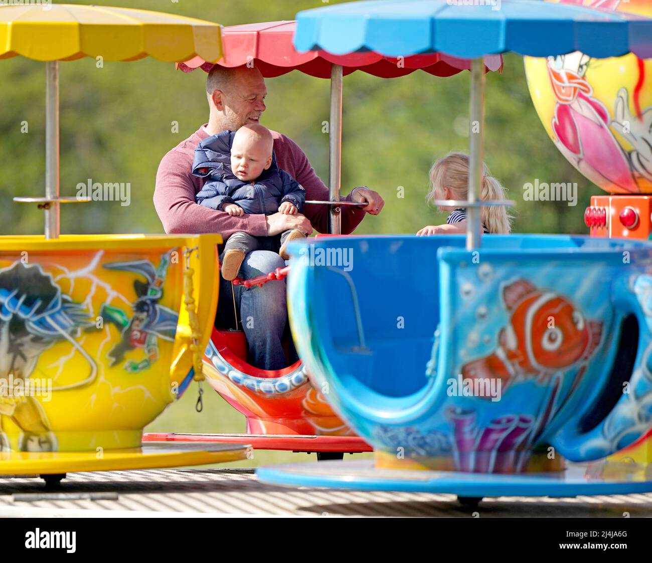 Mike Tindall on the teacup ride with his son Lucas Tindall and daughter ...