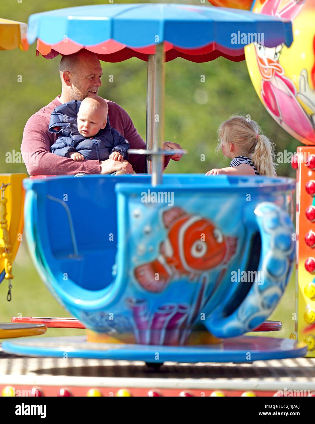 Mike Tindall on the teacup ride with his son Lucas Tindall and daughter ...