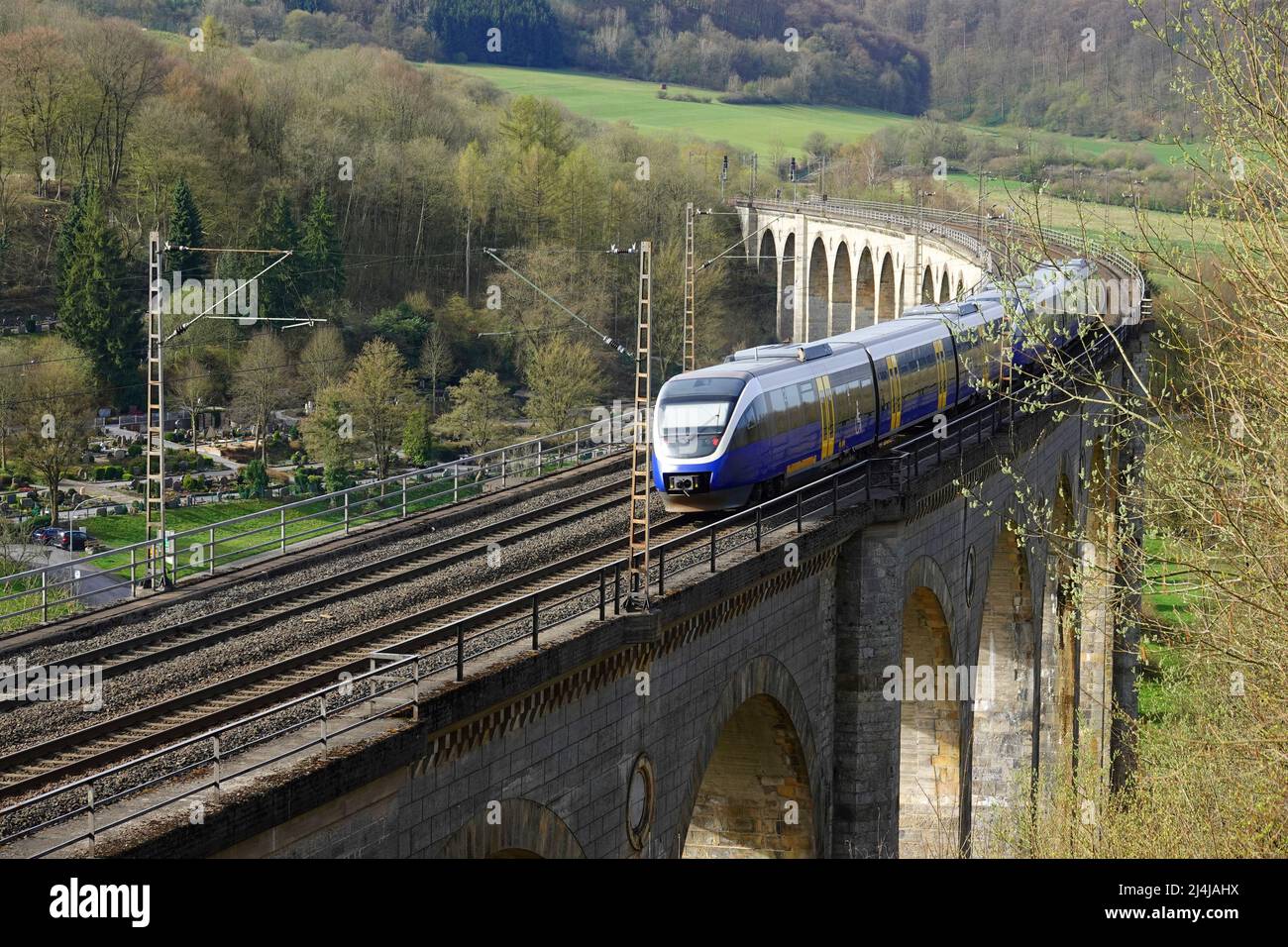 A train is speeding over an old railway viaduct. It is a 482 metres ...