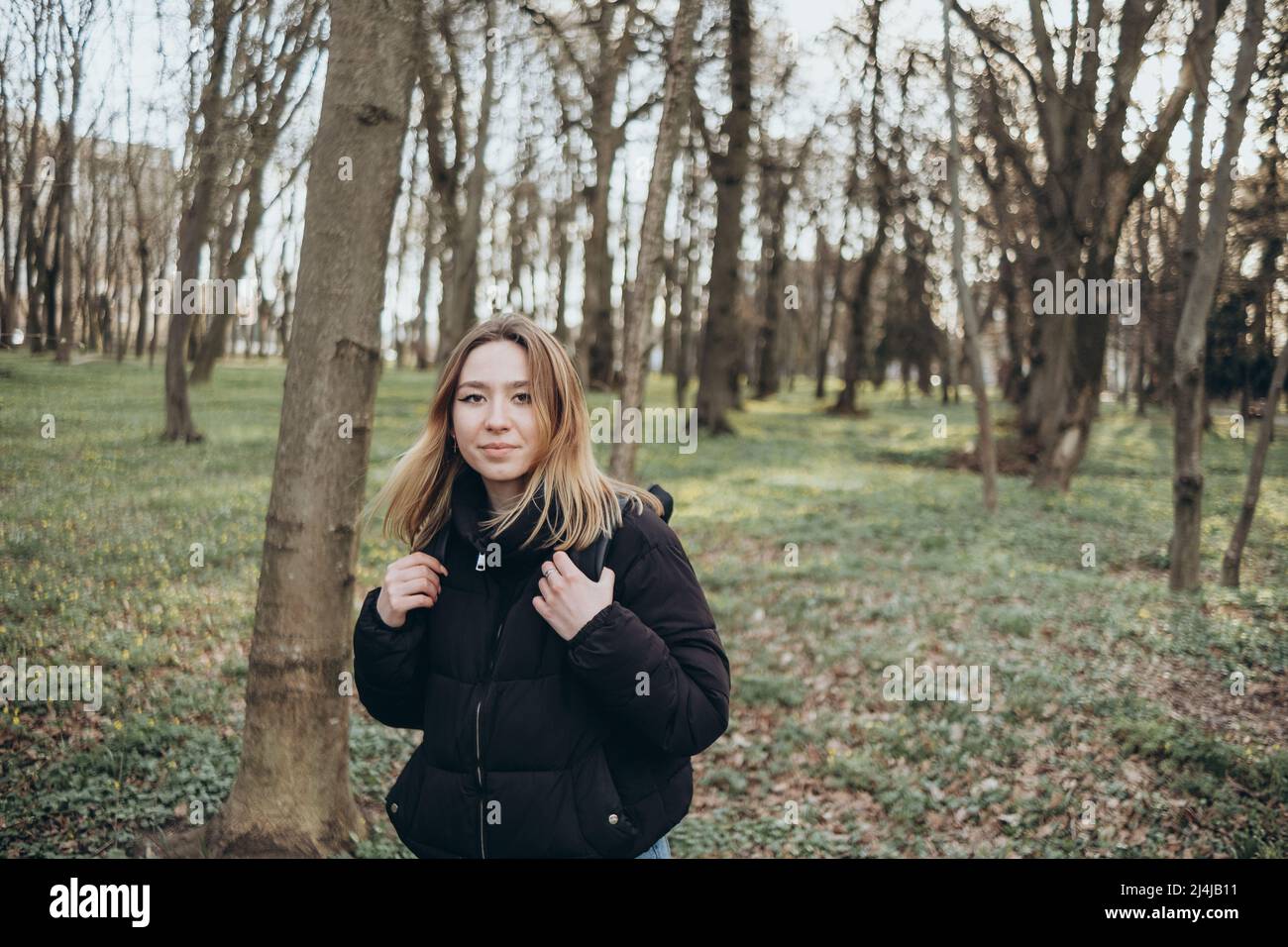 woman traveler with backpack and looking at amazing forest, wanderlust ...