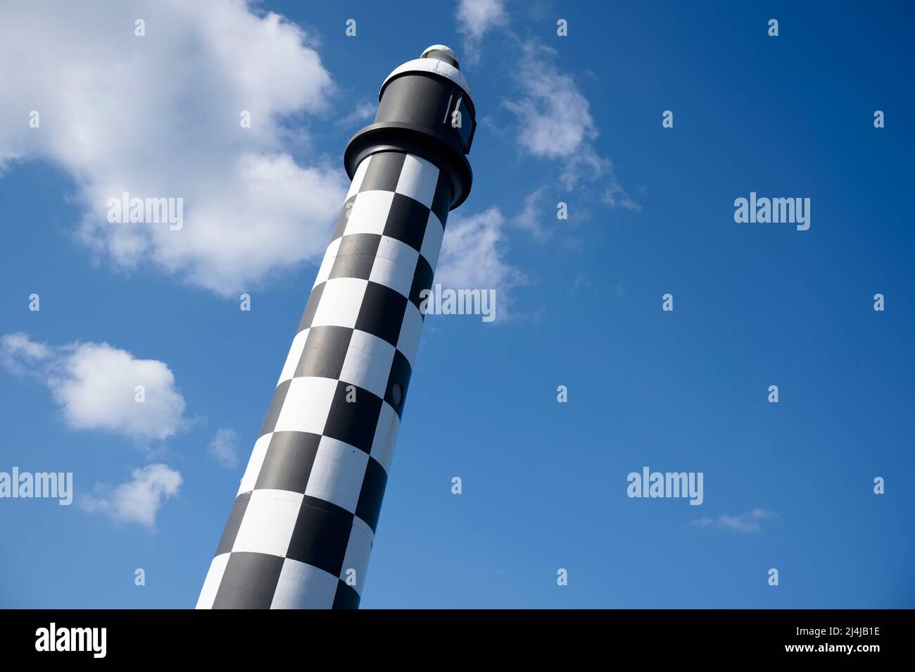 Lighthouse with black and white chequer design Stock Photo - Alamy