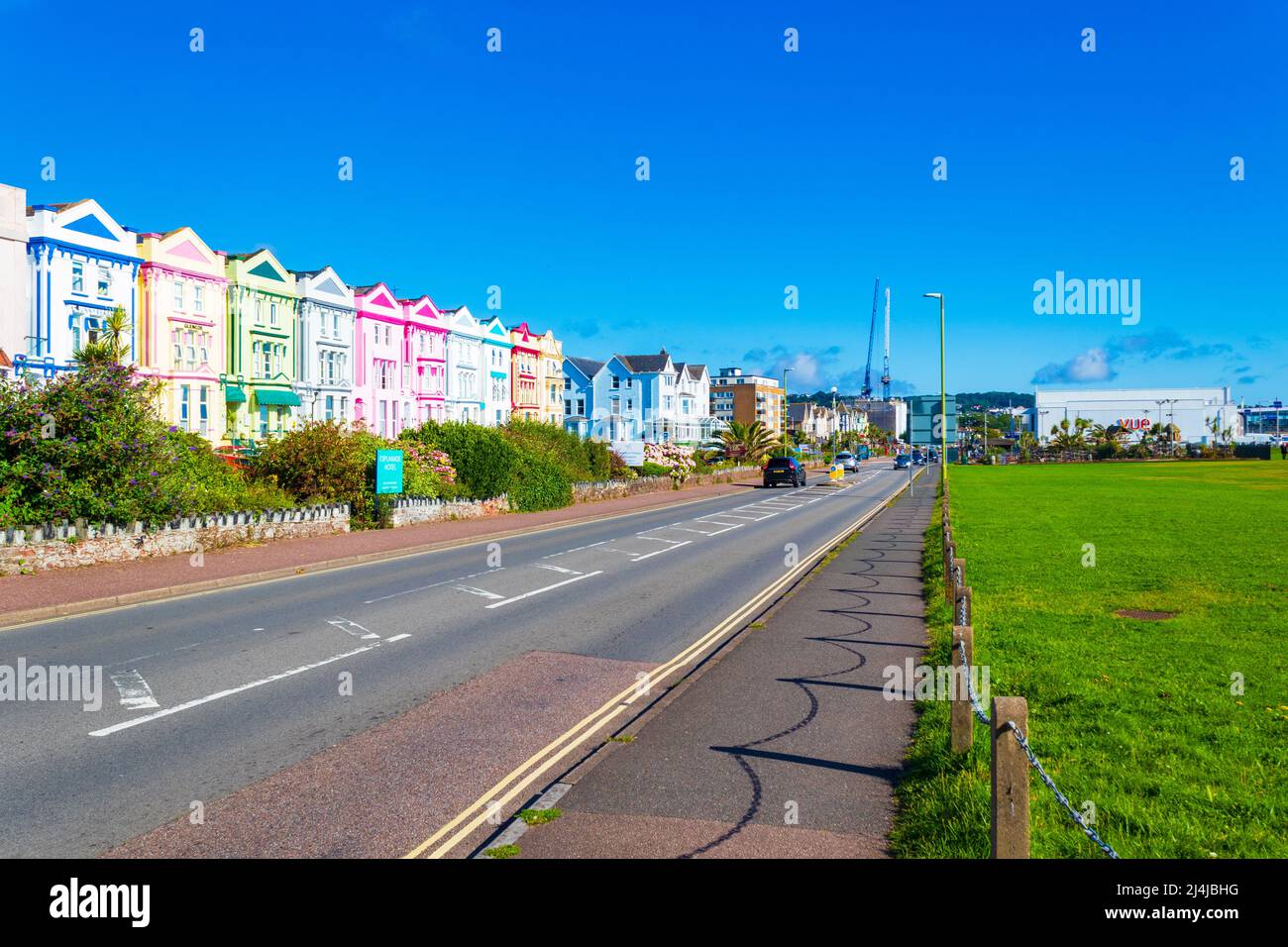Colorful beachside traditional buildings along the coastal street by ...