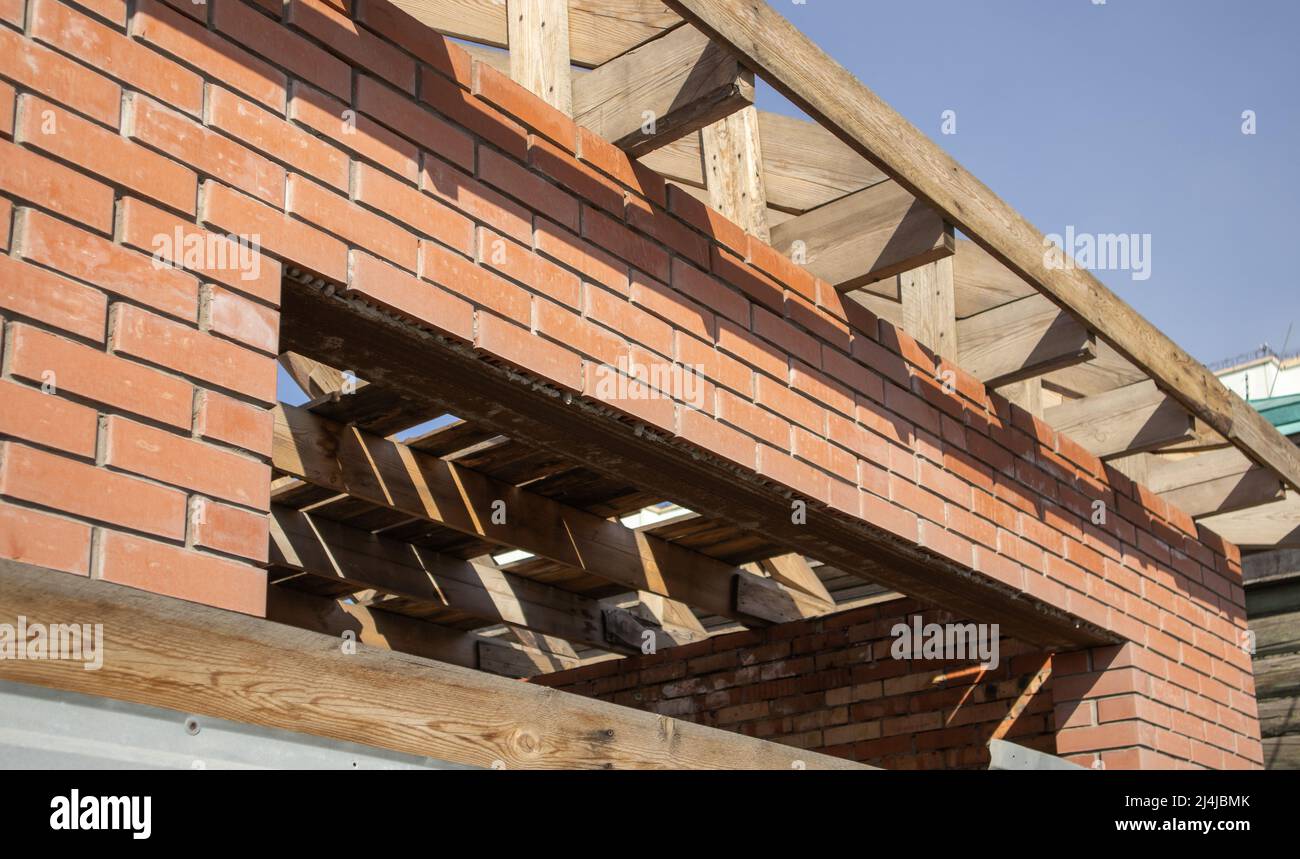 A private residential building under construction with a wooden frame ...