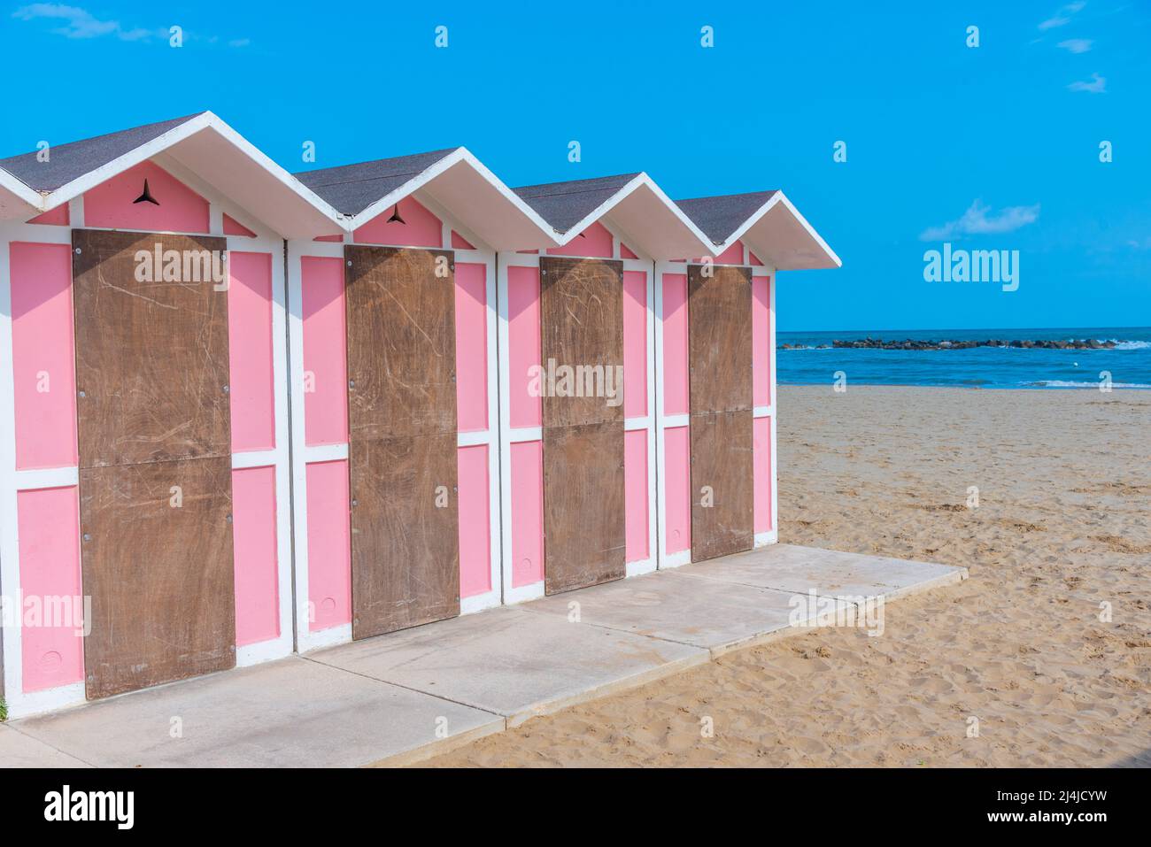 Colourful changing rooms on a beach in Pesaro, Italy Stock Photo - Alamy