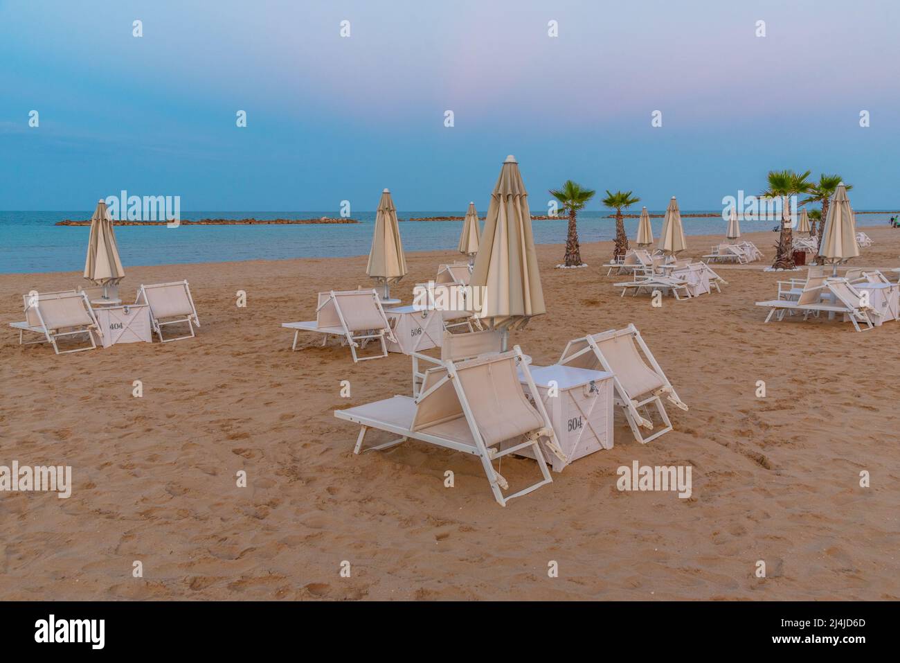 Sunbeds on a beach in Italian town Pesaro Stock Photo - Alamy