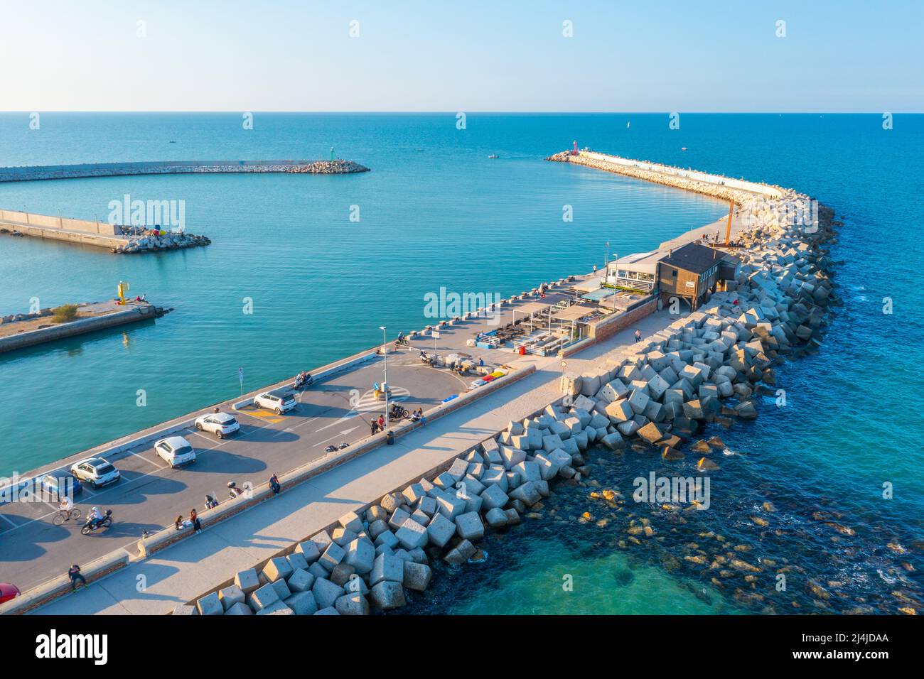 Stone breakwater in the Italian town Pesaro Stock Photo - Alamy