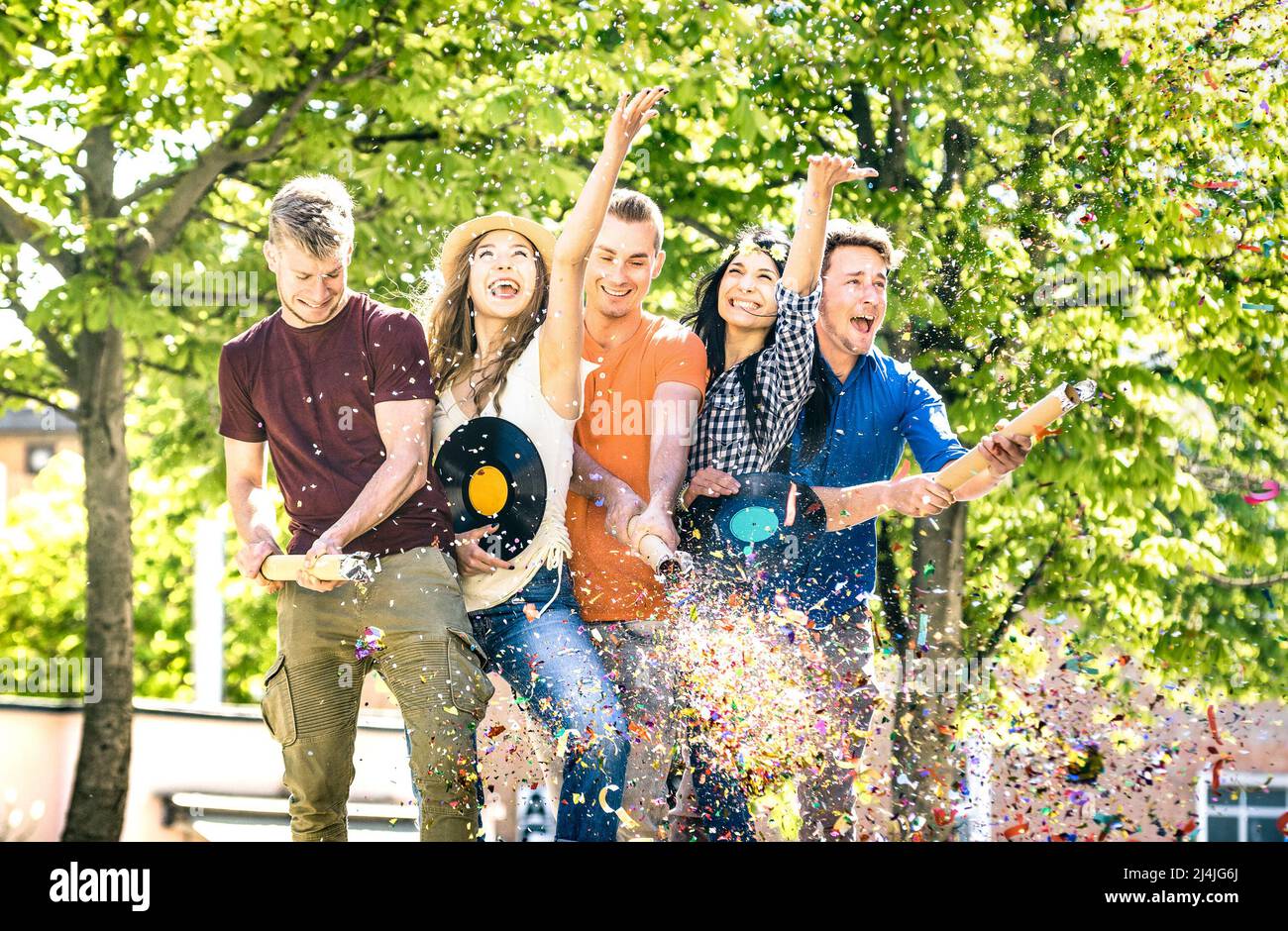 Group of happy excited friends having fun outdoor cheering with ...