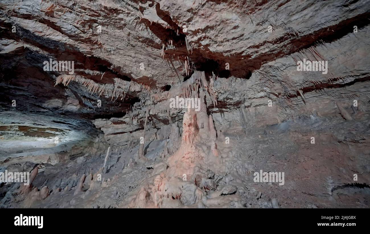 Cave. Action. The interior of the rock with huge ceilings of gray and ...