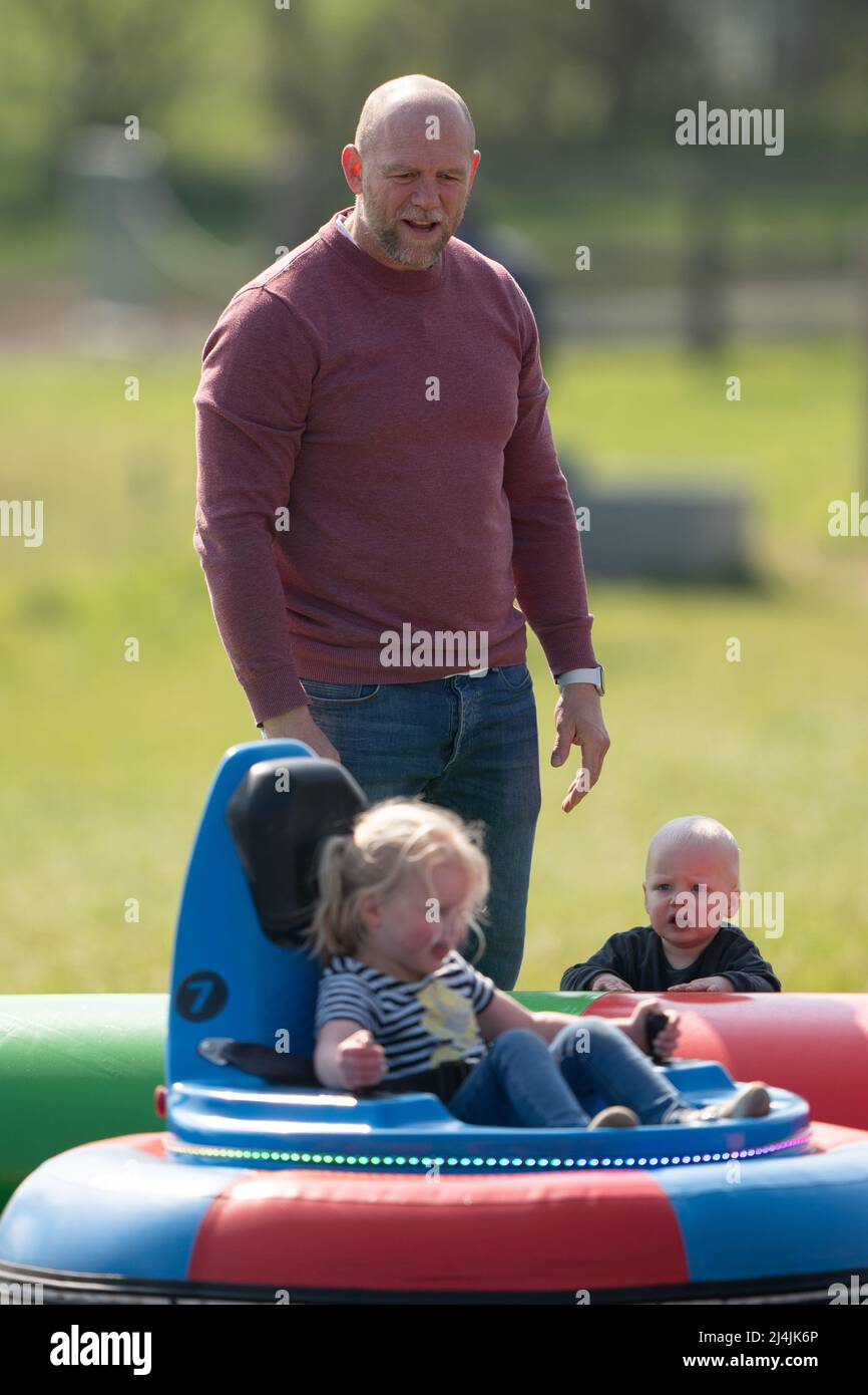 Mike Tindall and his son Lucas watch daughter Lena on a fairground ride ...
