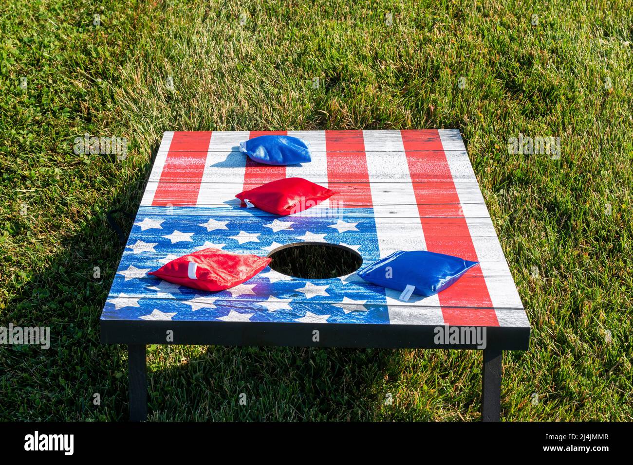 Close up of an American Flag cornhole game with red and blue bean bags ...