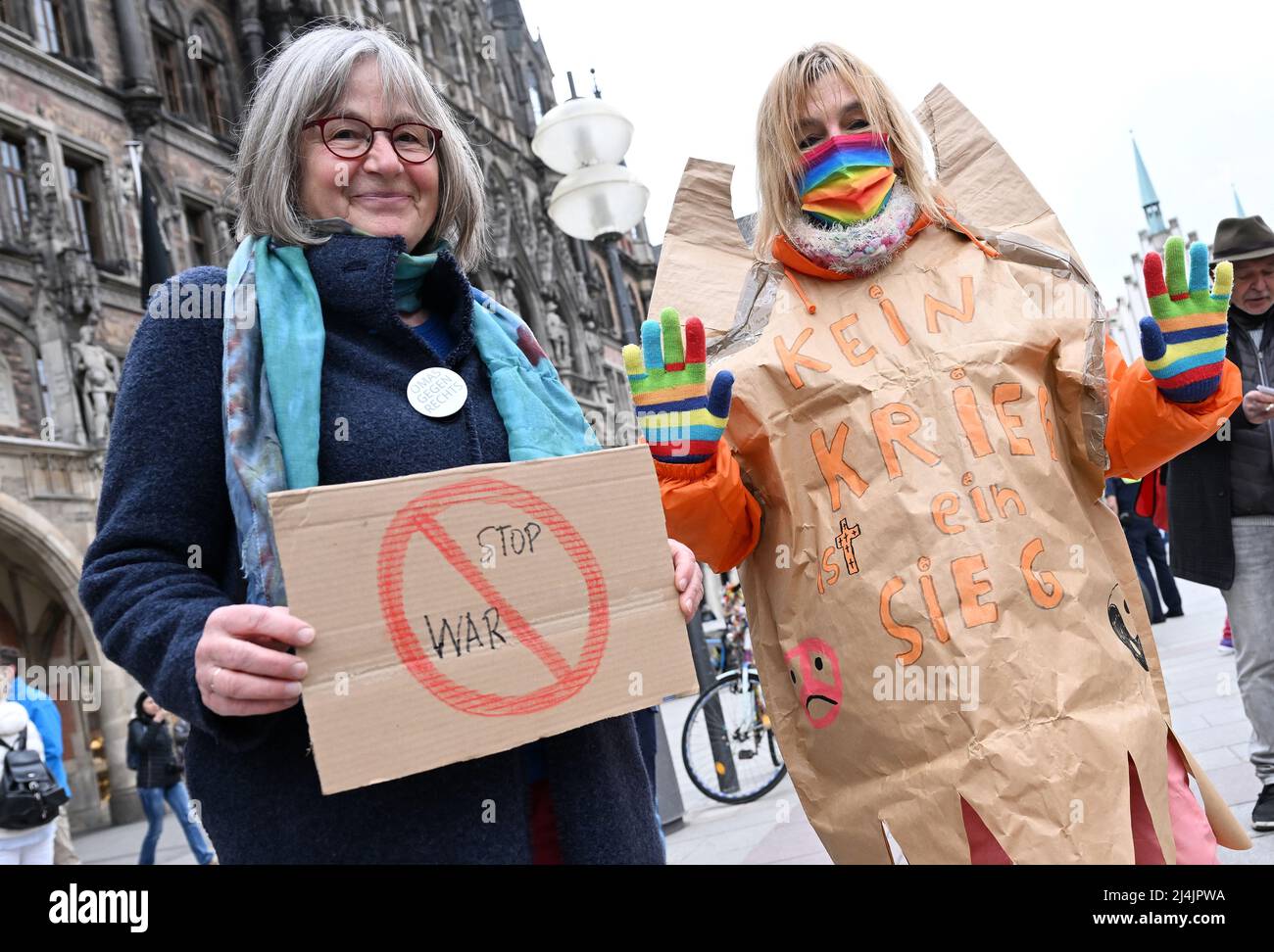 16 April 2022, Munich: Participants at the Easter march in Munich hold ...