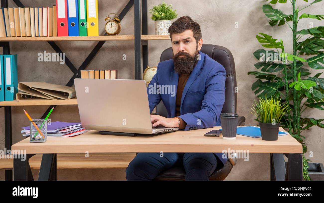 brutal serious network administrator with pc at office, office worker Stock Photo - Alamy