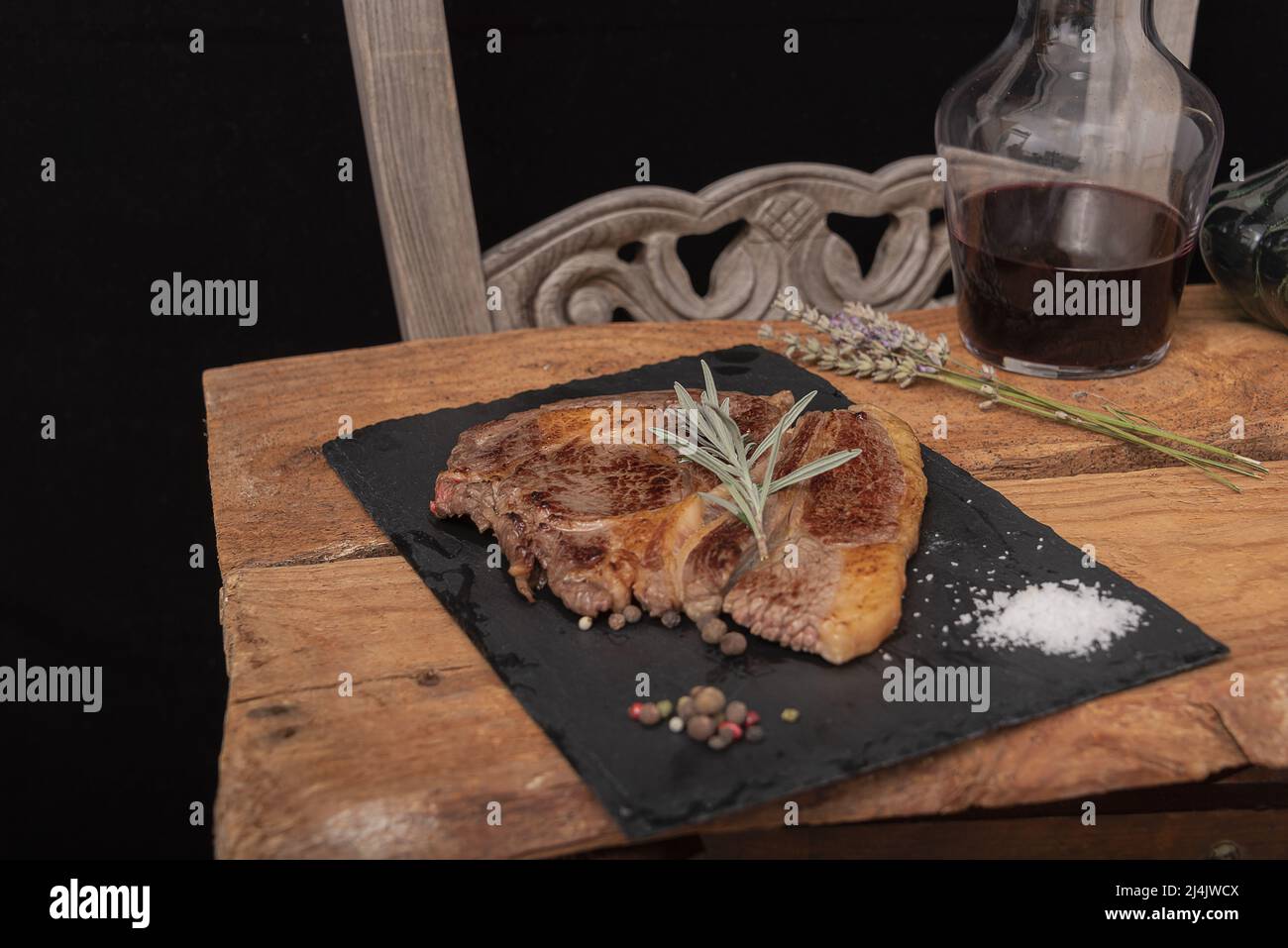 Beef on a slab of dark stone Stock Photo - Alamy