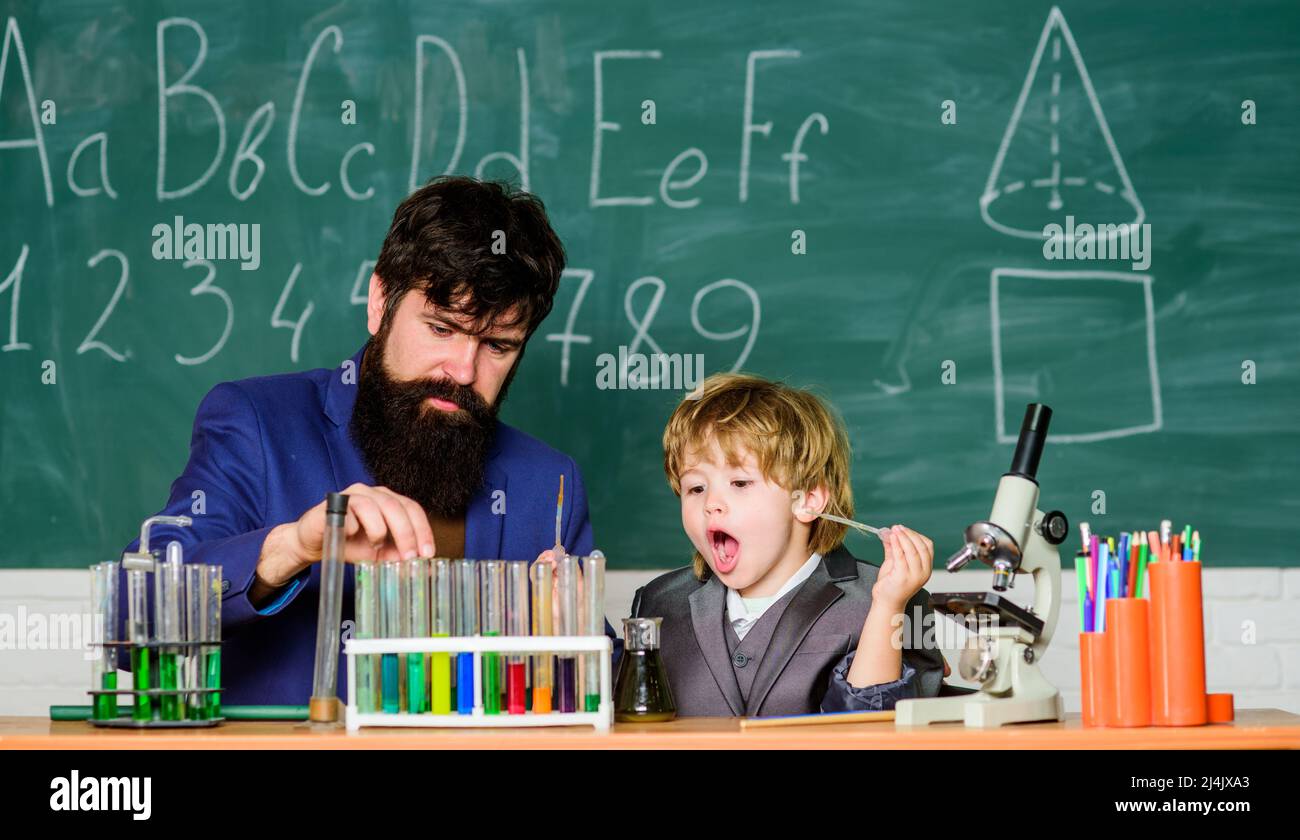 laboratory research and development. father and son at school. science ...