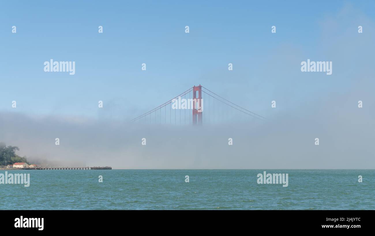 Golden Gate Bridge in a foggy weather. Only one tower is visible ...