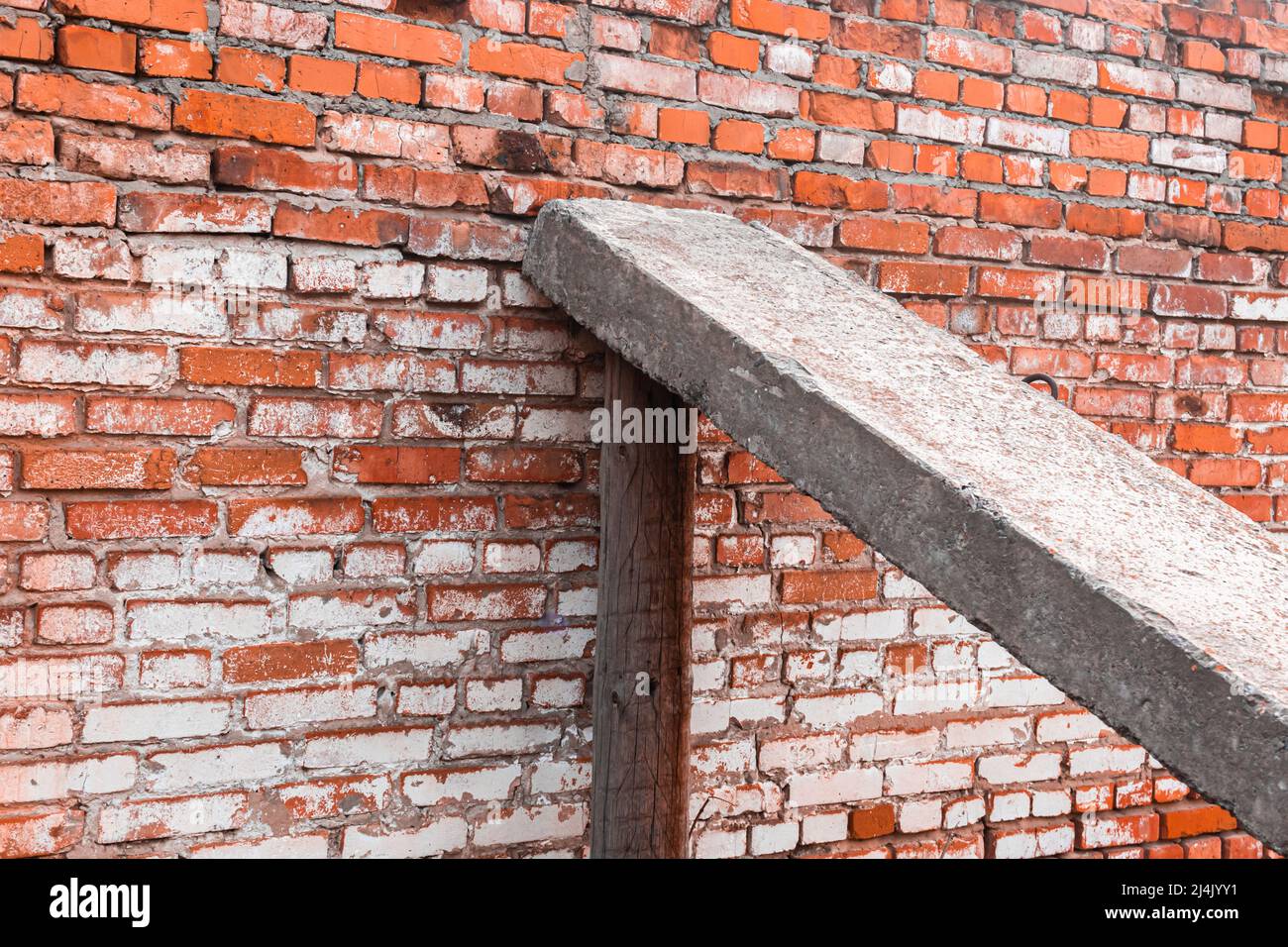 Falling brick wall with prop, old structure and damaged architecture ...