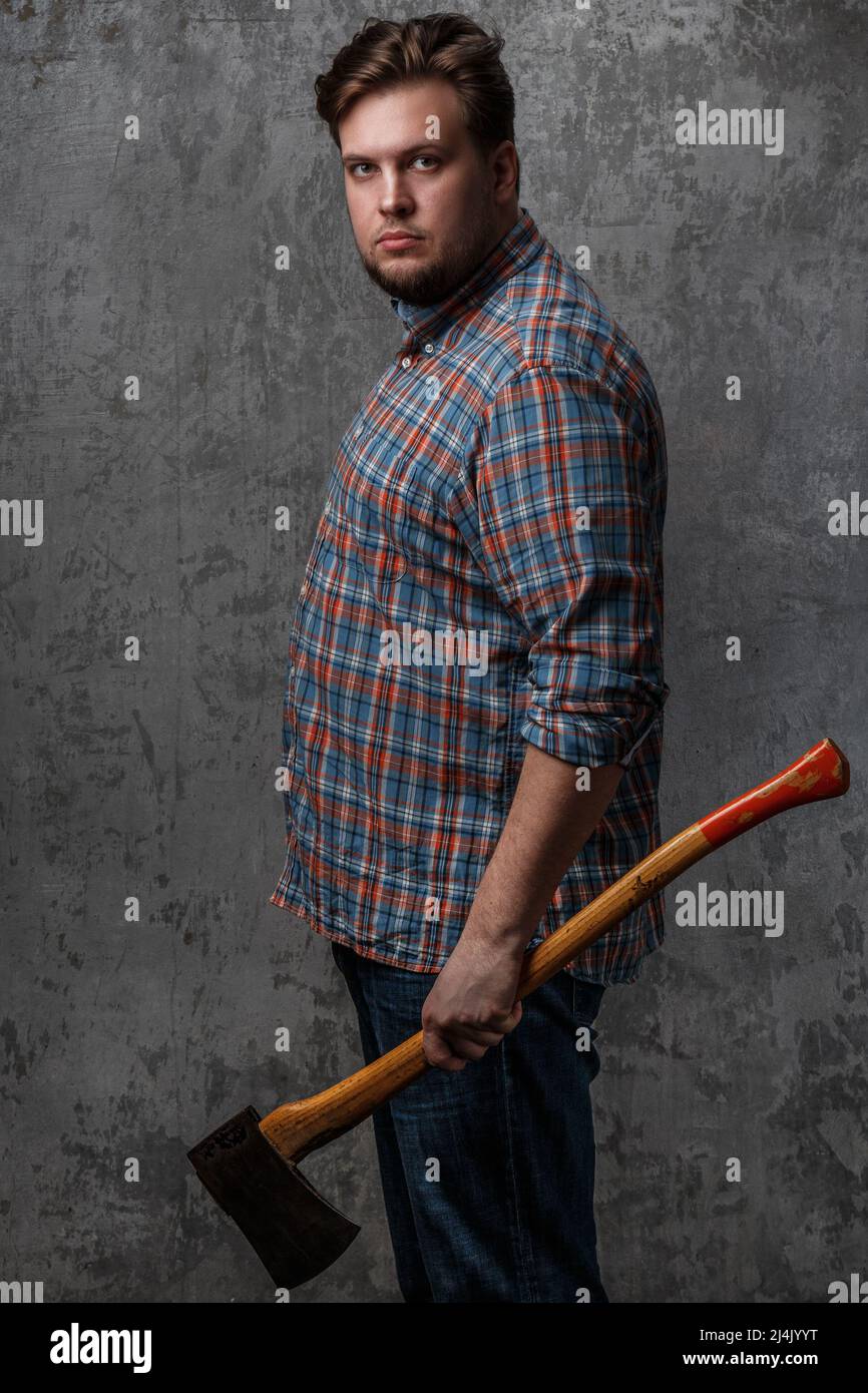 Portrait of bearded man with axe posing in studio Stock Photo - Alamy