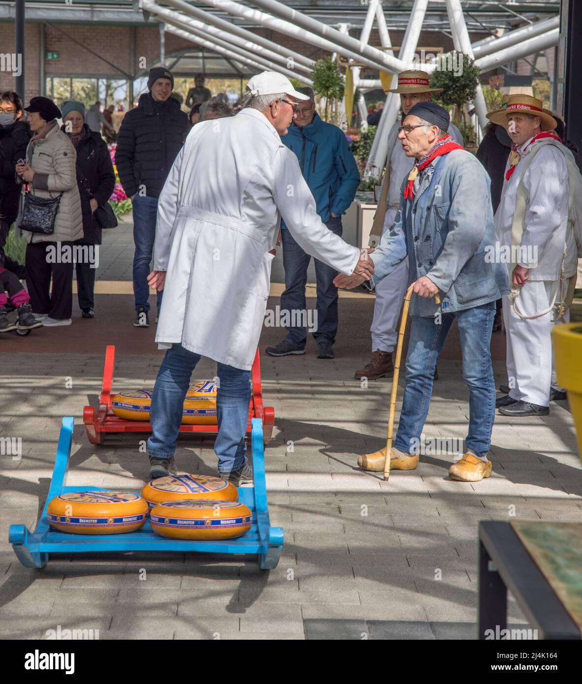a farmer and cheese buyer using the famous hand slapping method to buy ...