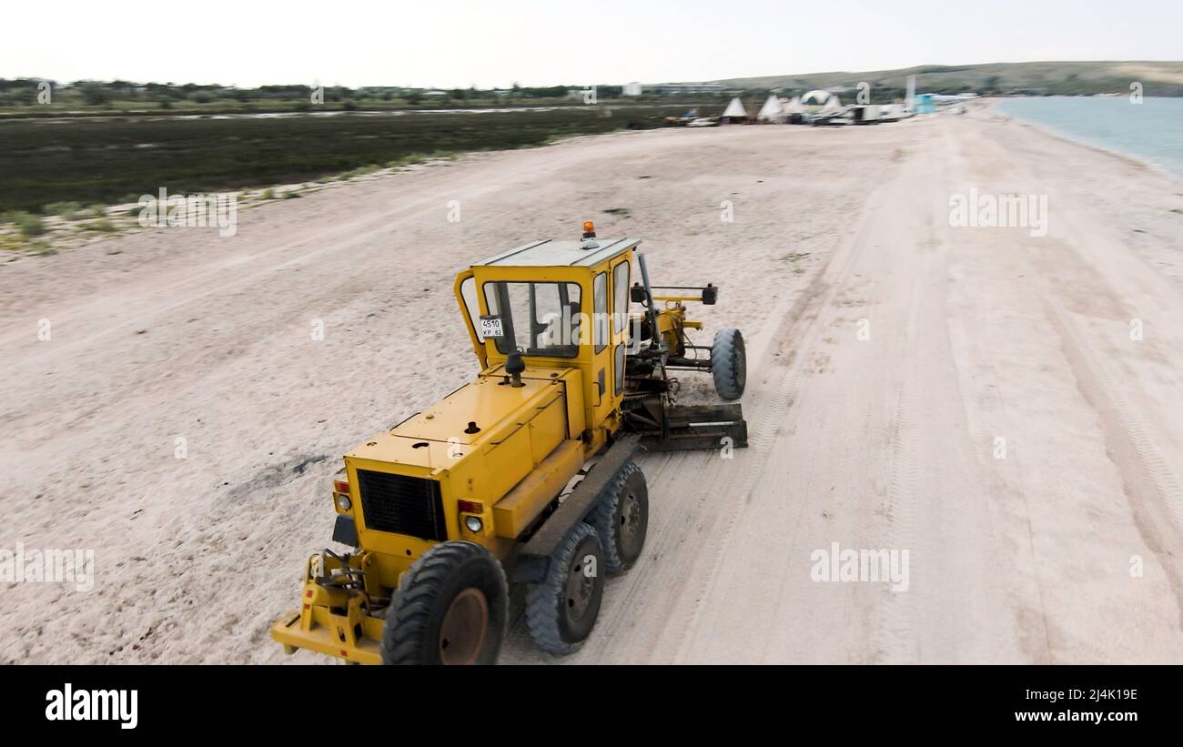 Yellow transport on the beach. Action. View of thw drone. Wonderful ...