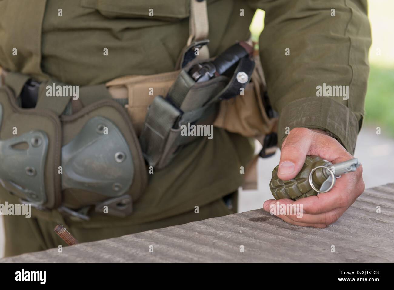 Grenade in hand on woman military training. Practicing with dangerous ...