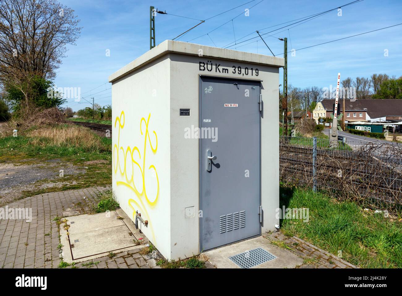 Relay station of a level crossing with barriers Stock Photo - Alamy