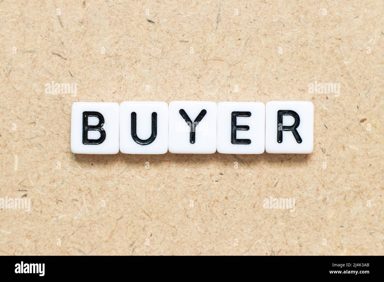 White tile alphabet letter with word buyer on wood background Stock ...