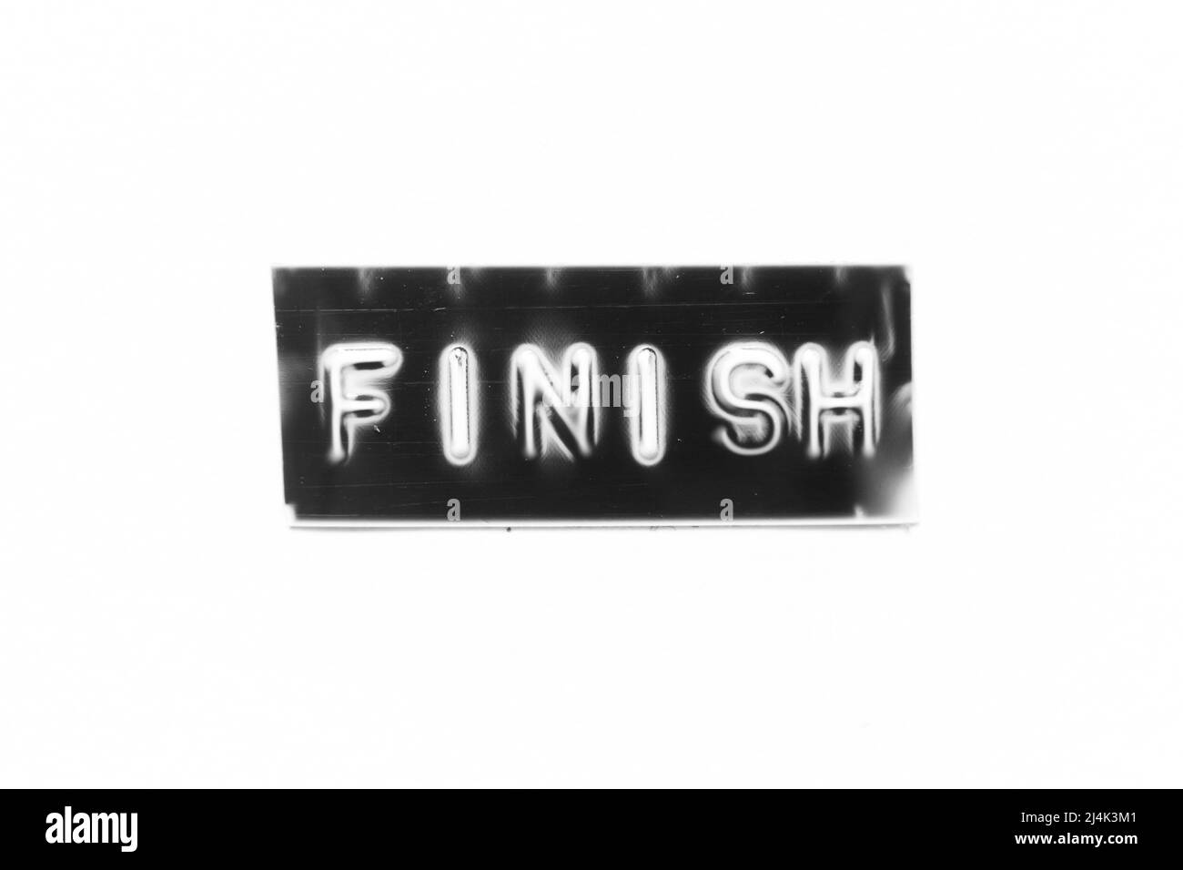 Black color banner that have embossed letter with word finish on white ...