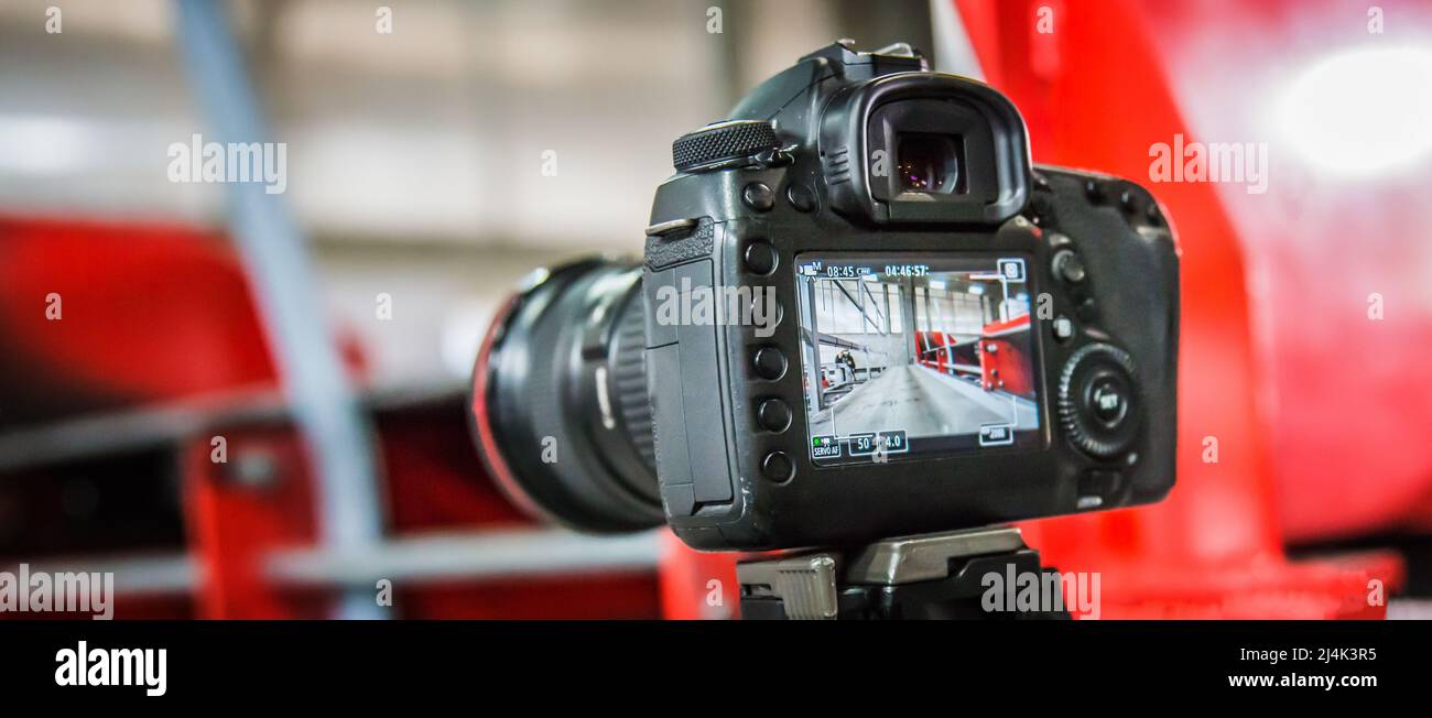 Photographer and videographer holding dslr camera and take photo or ...