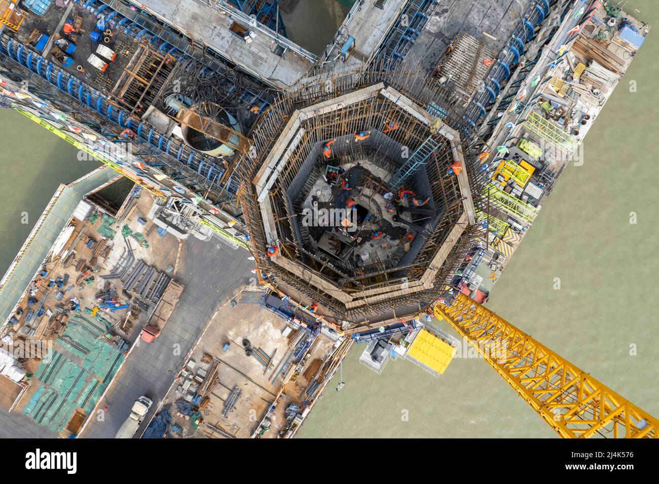 TAIXING, CHINA - APRIL 16, 2022 - Workers pour concrete on the beams of ...