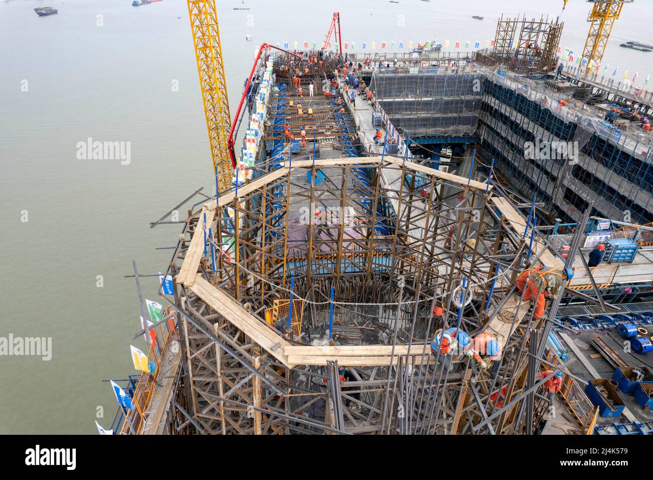 TAIXING, CHINA - APRIL 16, 2022 - Workers pour concrete on the beams of ...