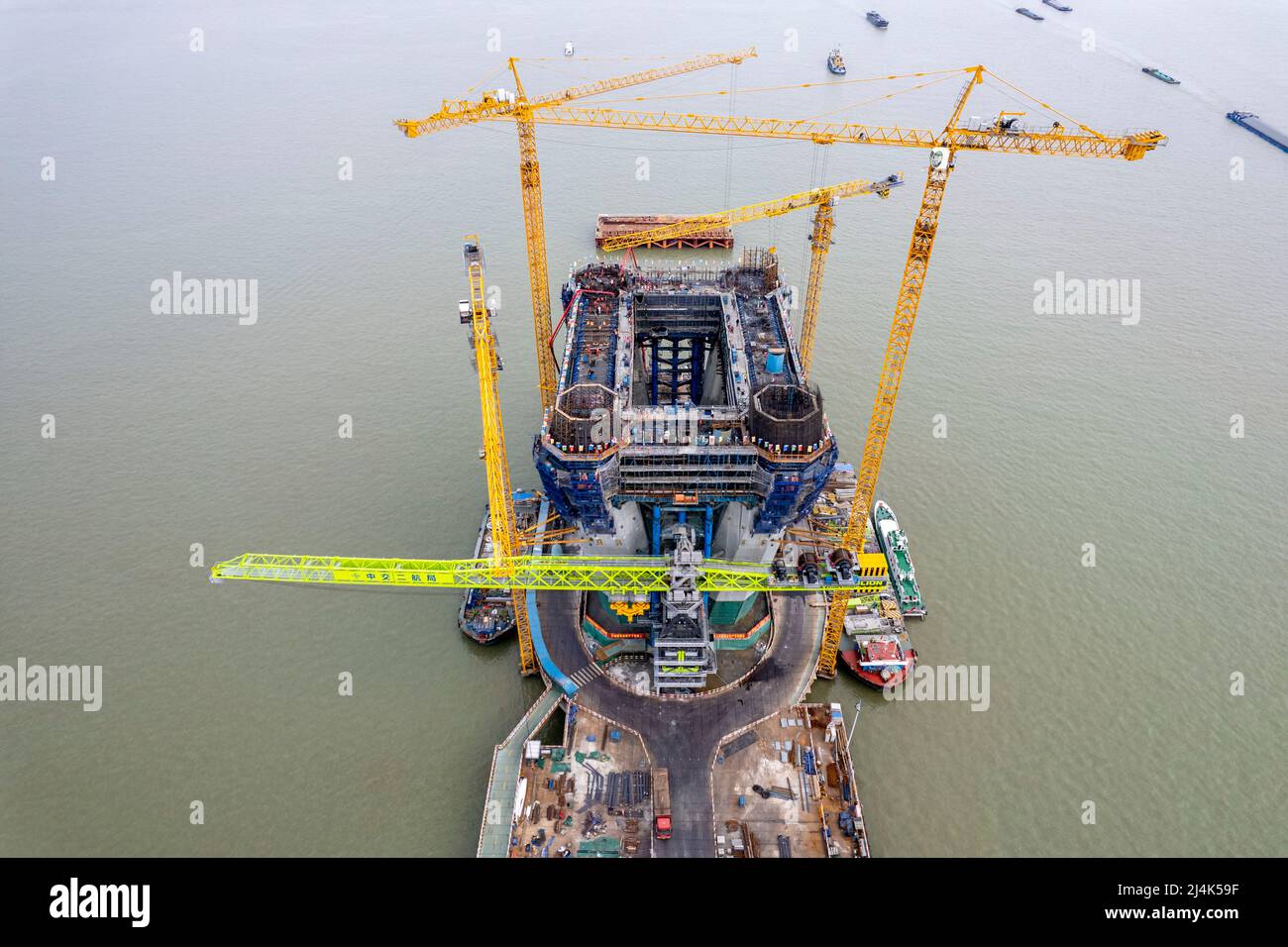 TAIXING, CHINA - APRIL 16, 2022 - Workers pour concrete on the beams of ...