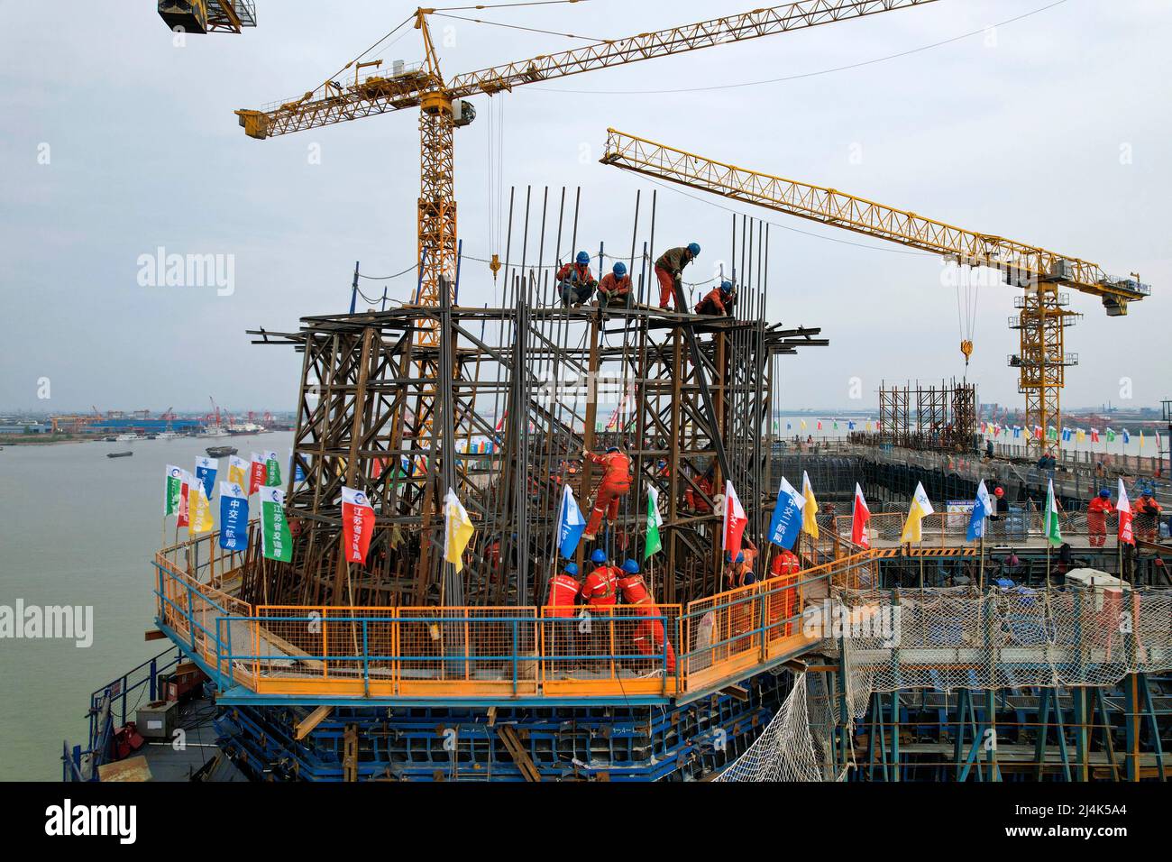 TAIXING, CHINA - APRIL 16, 2022 - Workers pour concrete on the beams of ...