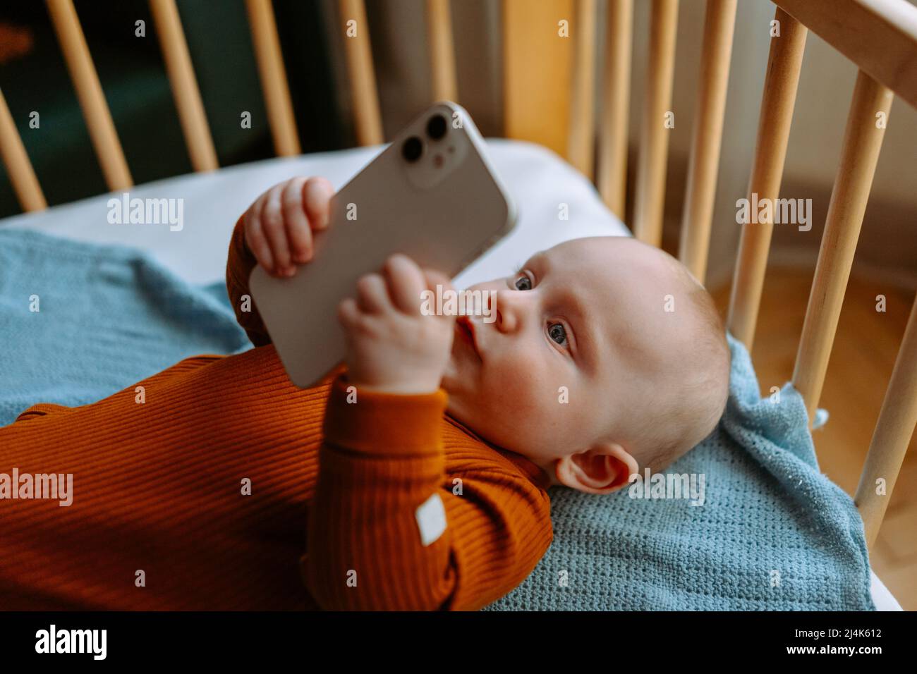 Adorable toddler baby boy watching baby story on phone Stock Photo - Alamy