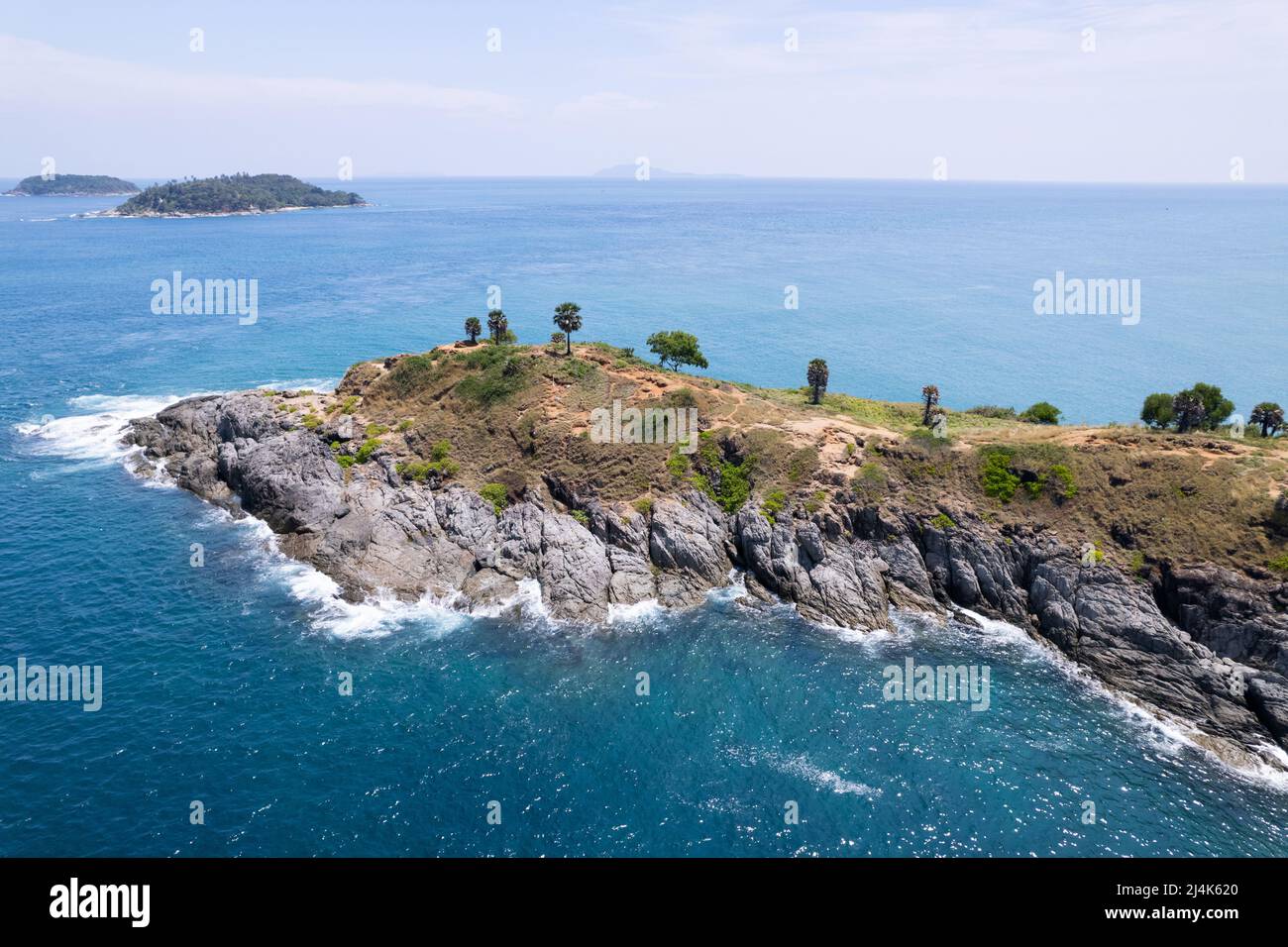 Aerial view phuket seashore Wave crashing on rocks at Laem promthep ...