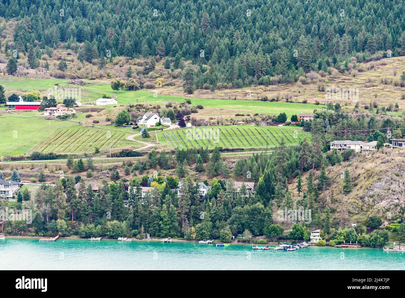 Waterfront land terrace with farm fields and residential houses built ...