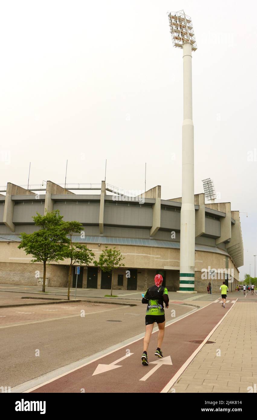 Runners on a cycle path running towards the stadium of racing santander ...