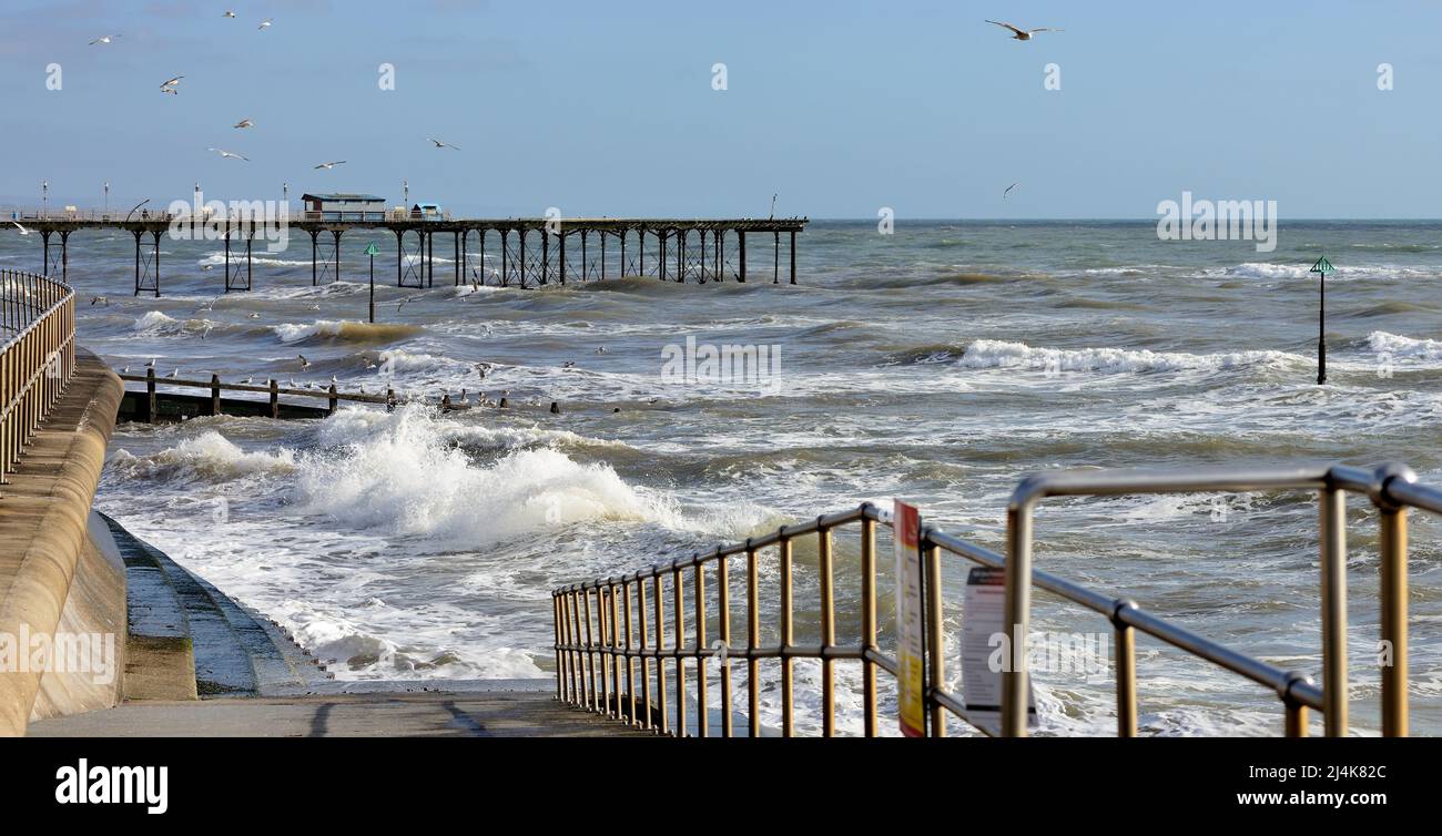 Waves crashing against the seawall at high tide, Teignmouth, South ...